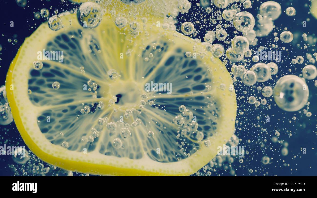 Underwater of freshly squeezed sweetened lemonade which raw lemons ...