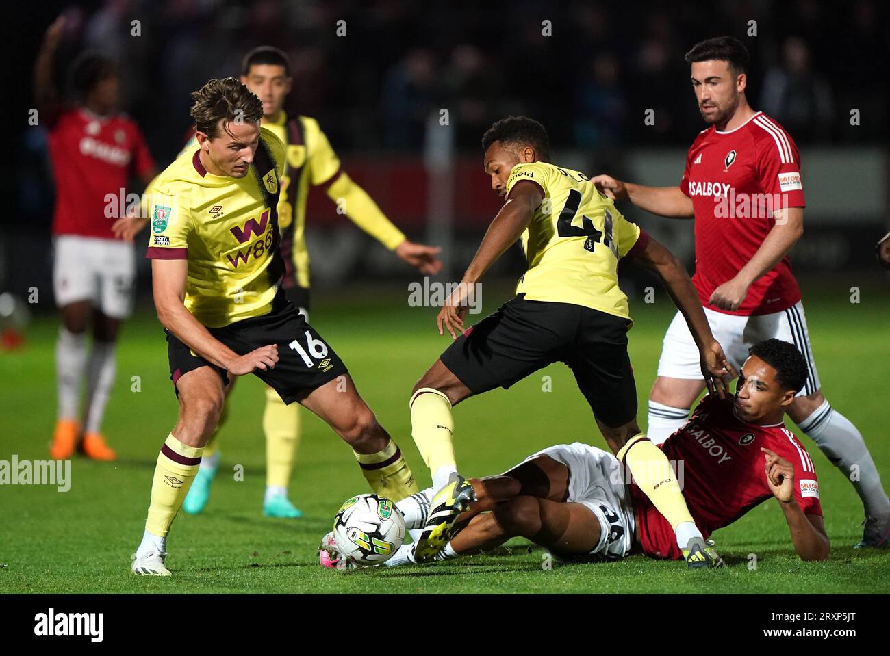 Burnley's Sander Berge (left) and Hannes Delcroix battle for the ball ...