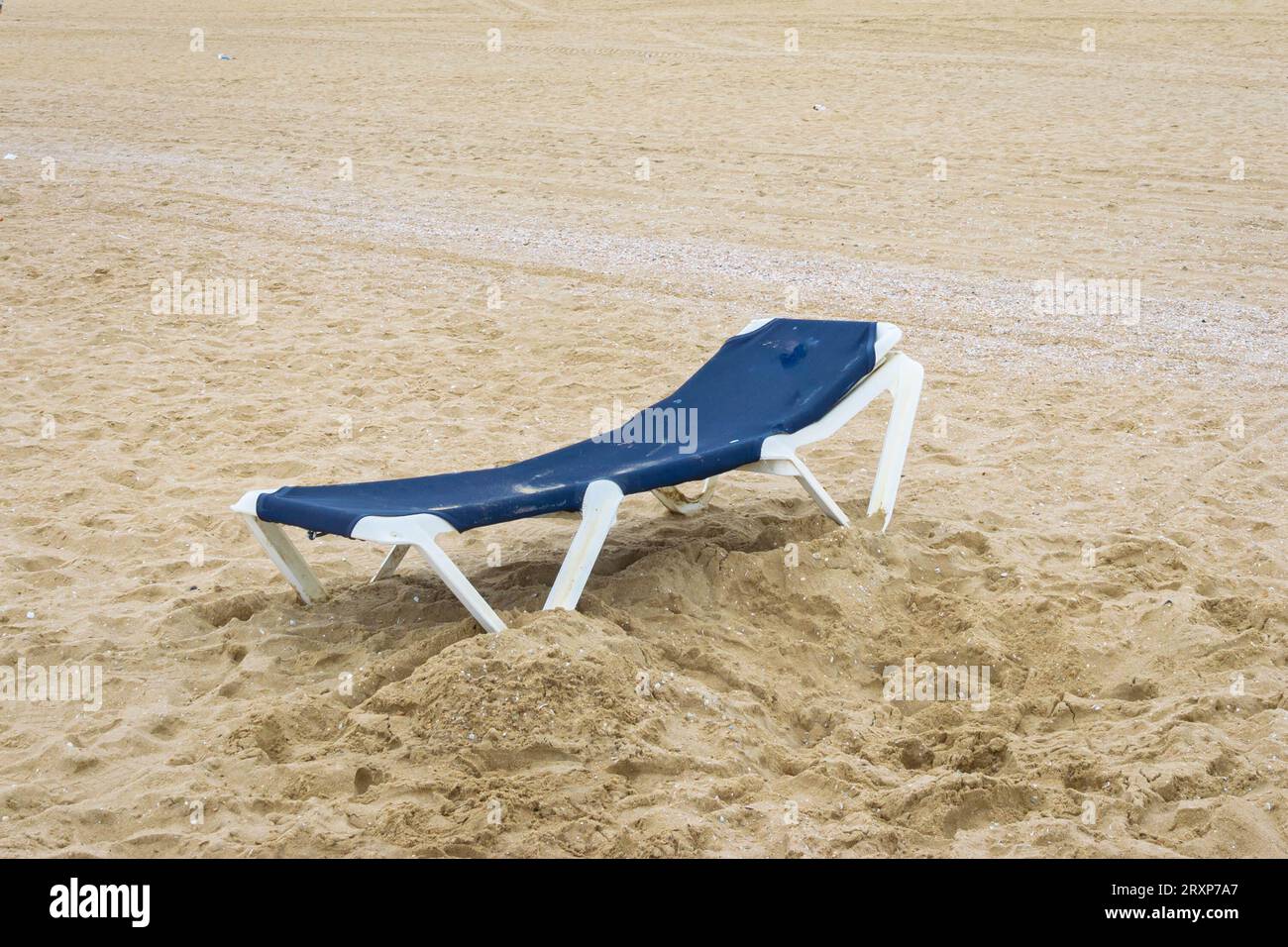 Lone chair on the beach Stock Photo - Alamy