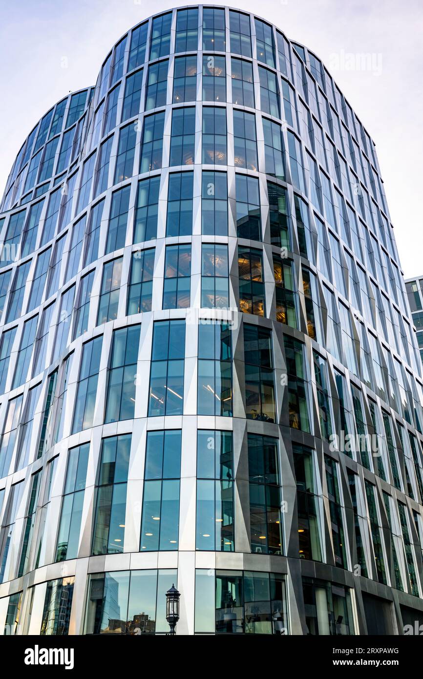 Urban cityscape of an attractive high-rise building made of glass with ...