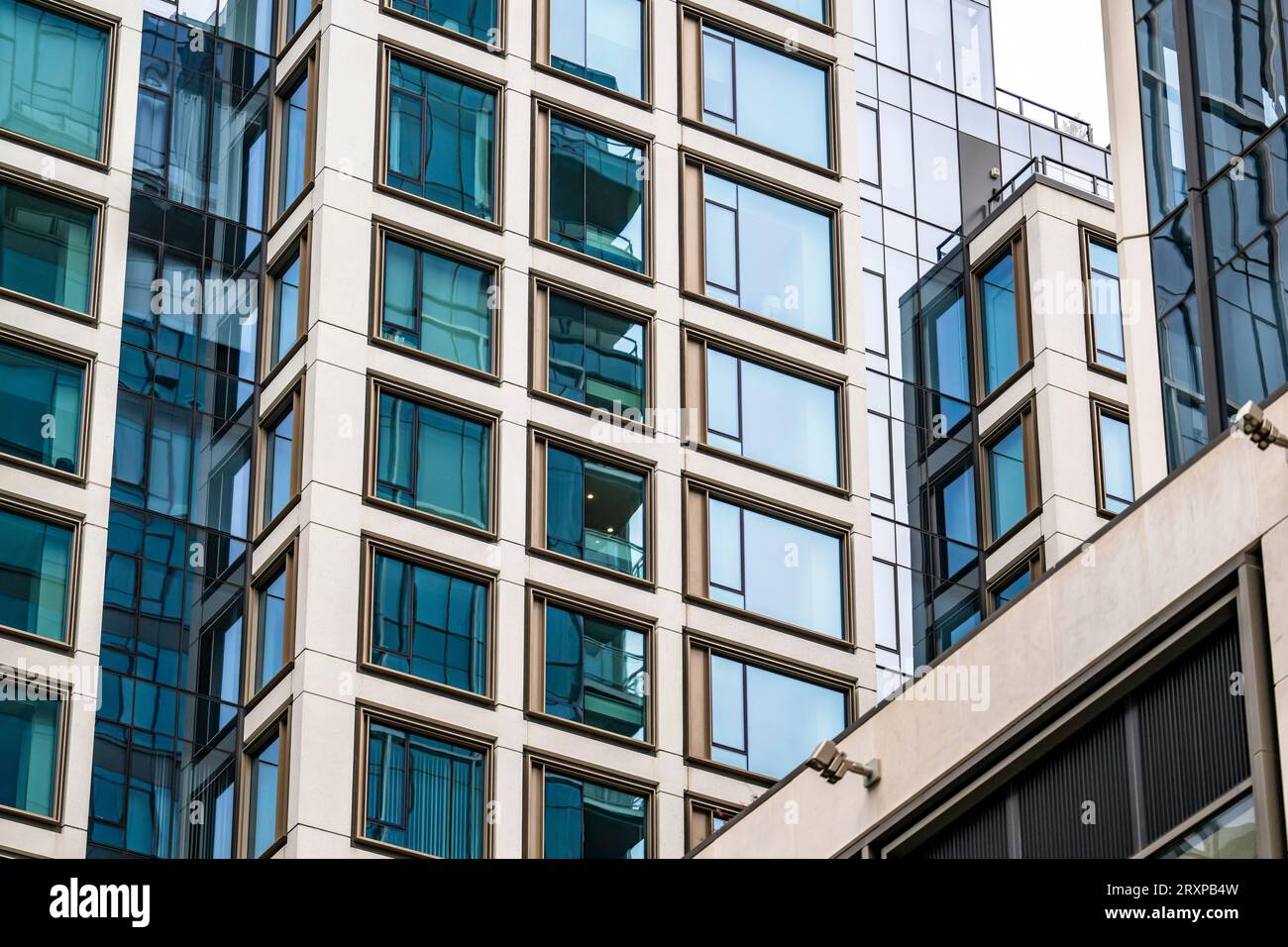 Skyscraper with avant-garde architecture with tinted glass lining in a ...