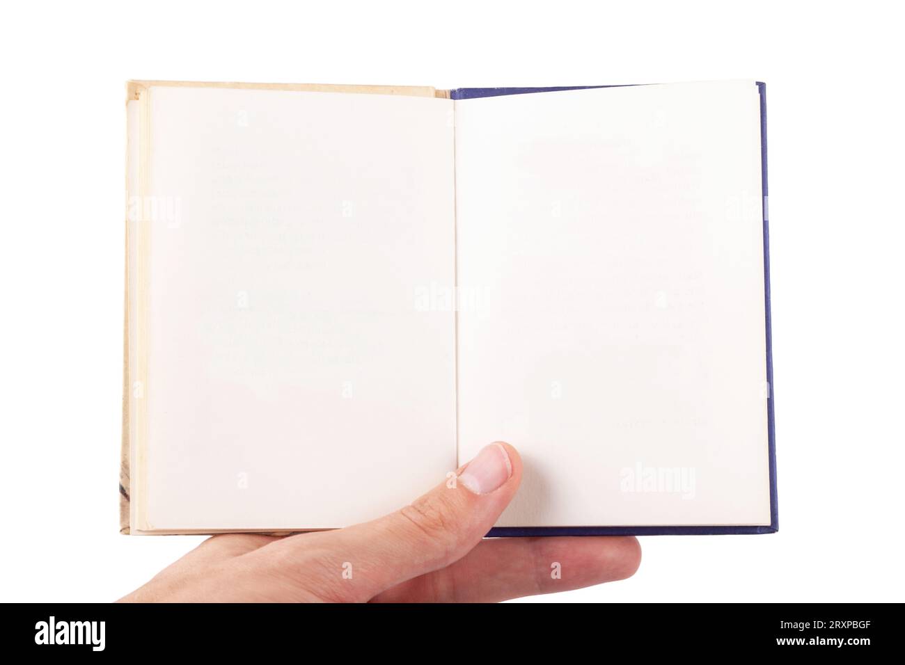 Hand holding a small size open book, handbook with empty blank white ...