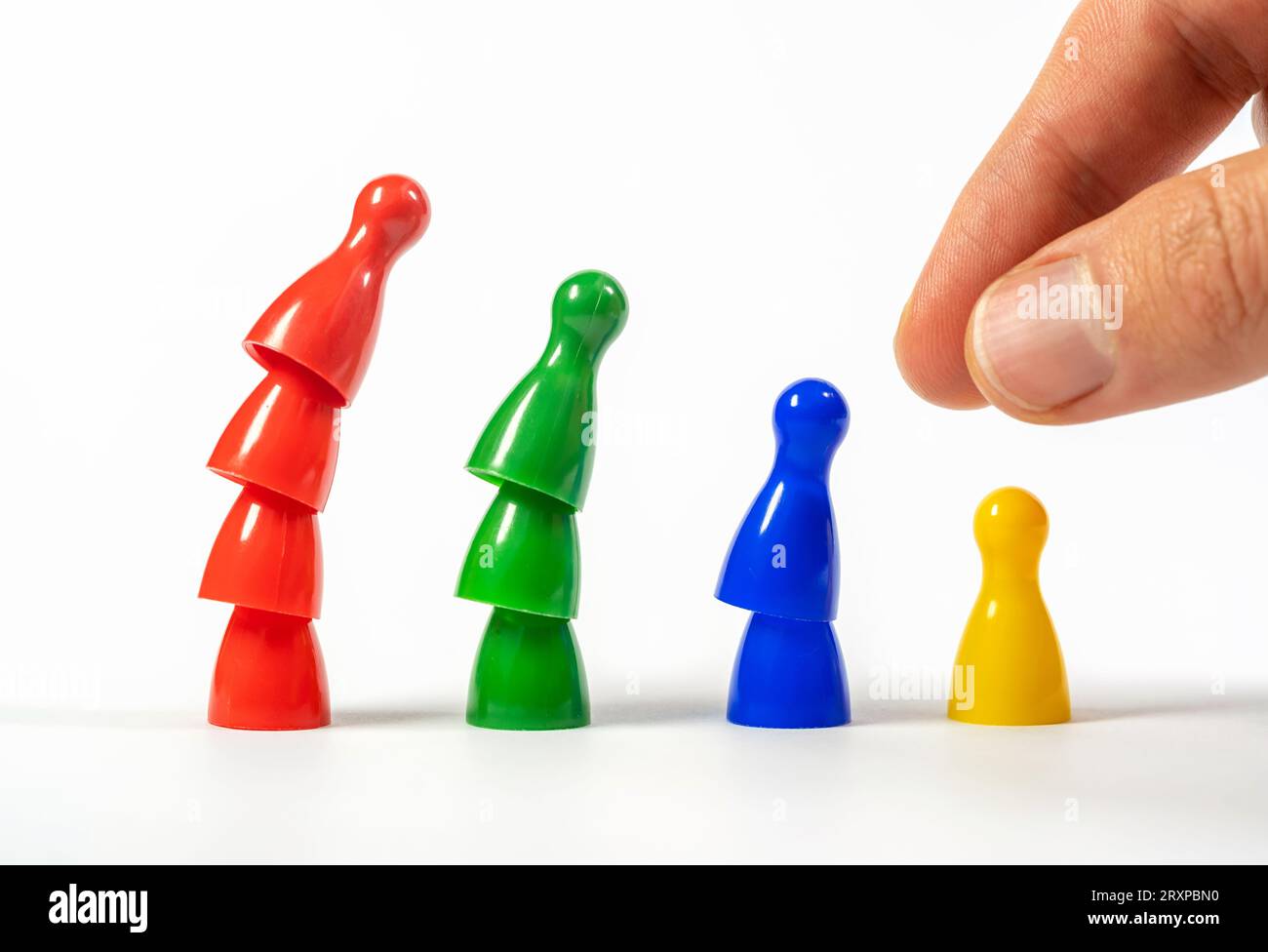Man, hand arranging, sorting colorful game pieces building a team by ...