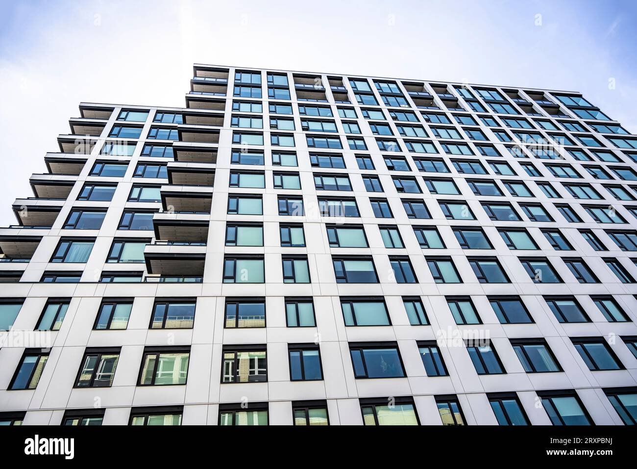 Skyscraper with avant-garde architecture with tinted glass lining in a ...