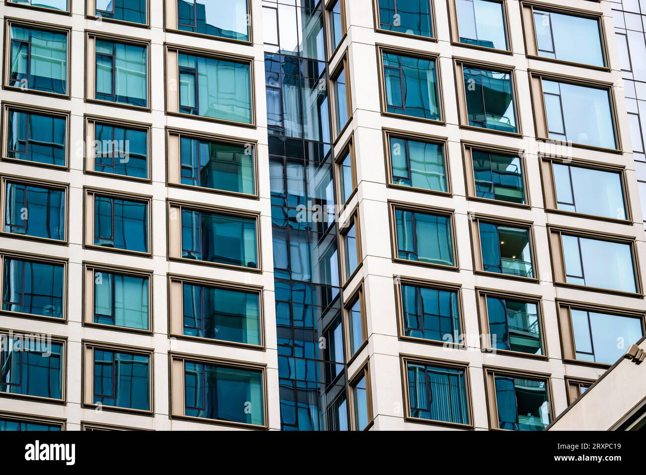 Skyscraper with avant-garde architecture with tinted glass lining in a ...