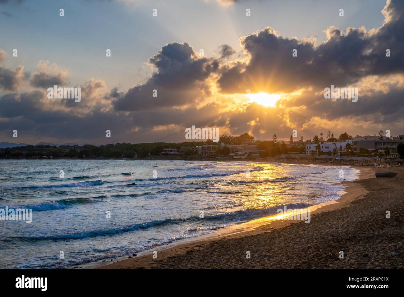 Fabulously shaped wave breaking on a sandy beach at sunrise in the ...