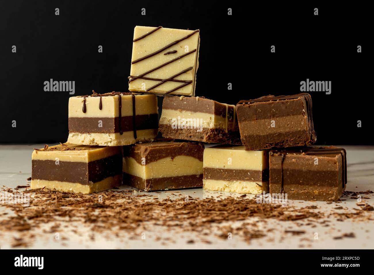 stacked moroccan or cremino style chocolate bars with grated chocolate ...