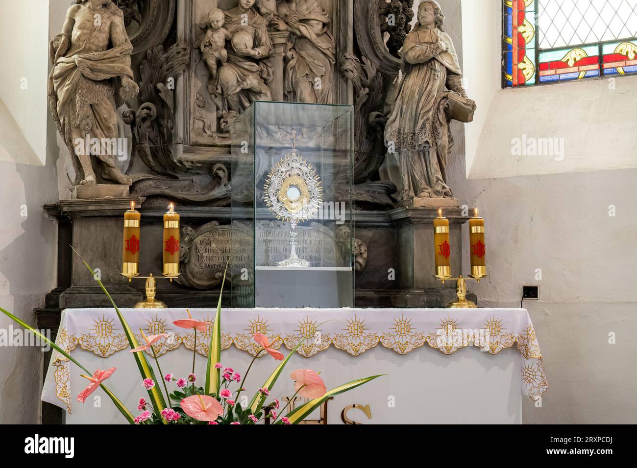 Shielded protected monstrance with an Eucharistic host inside in church ...