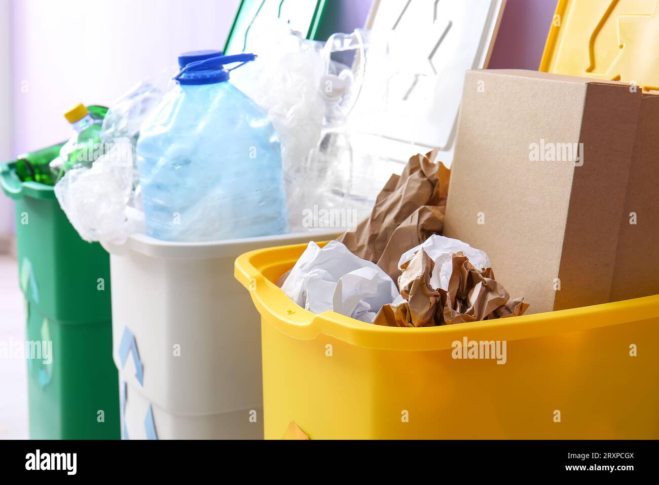 Containers with different types of garbage. Recycling concept Stock ...