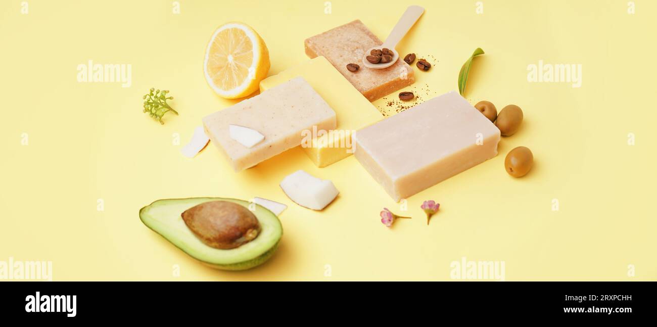 Composition with soap bars and natural ingredients on yellow background ...