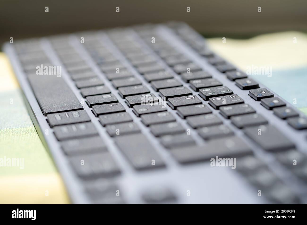 Simple modern wireless computer keyboard abstract background, shallow ...