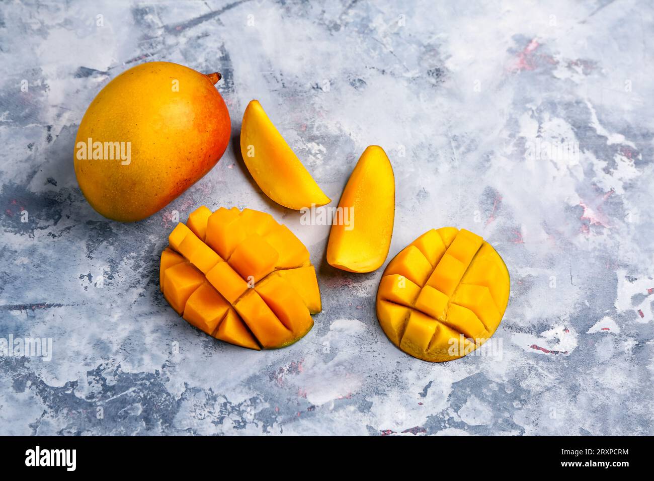 Fresh ripe mangoes on grunge background Stock Photo - Alamy