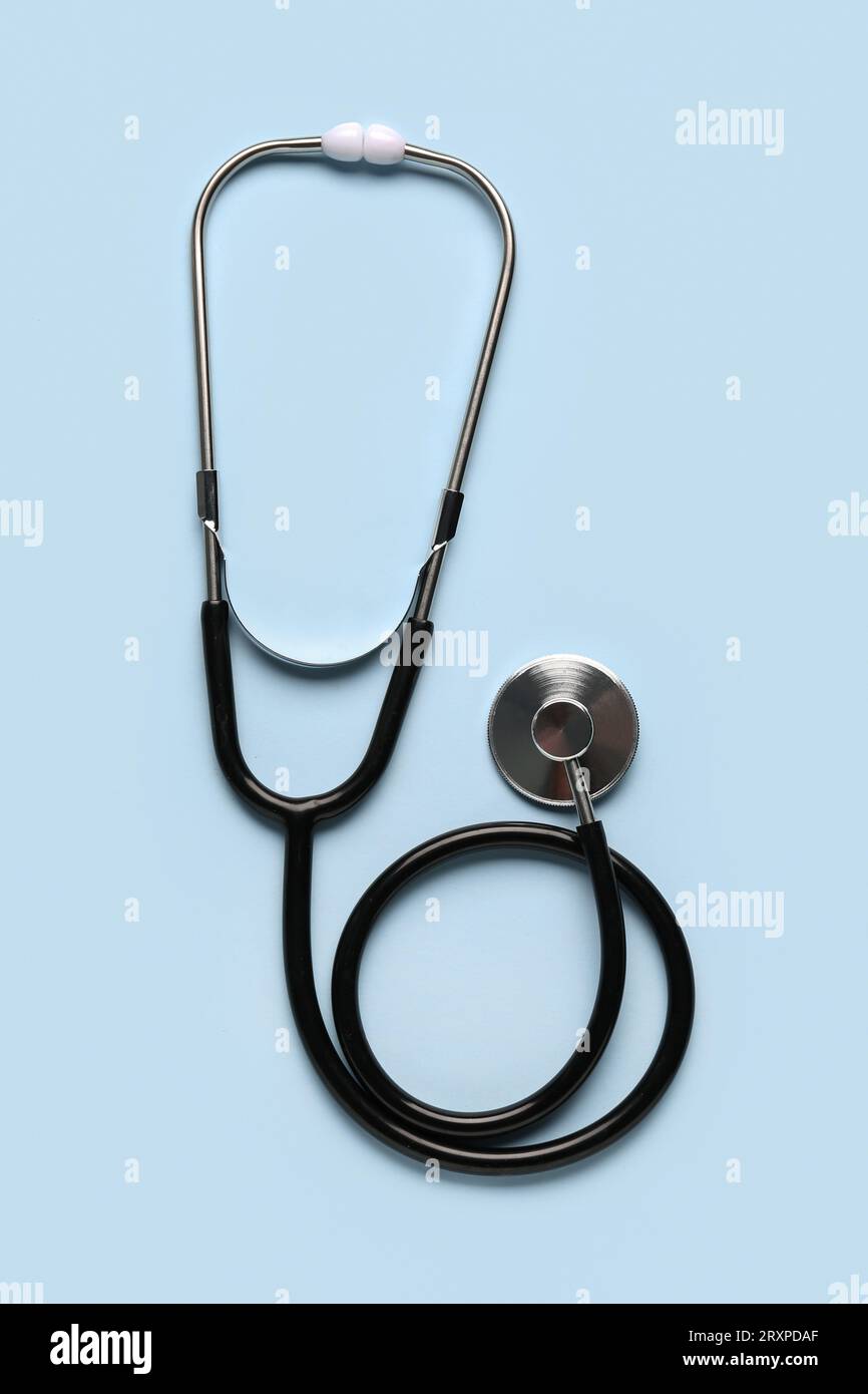 Modern stethoscope on light blue background Stock Photo - Alamy