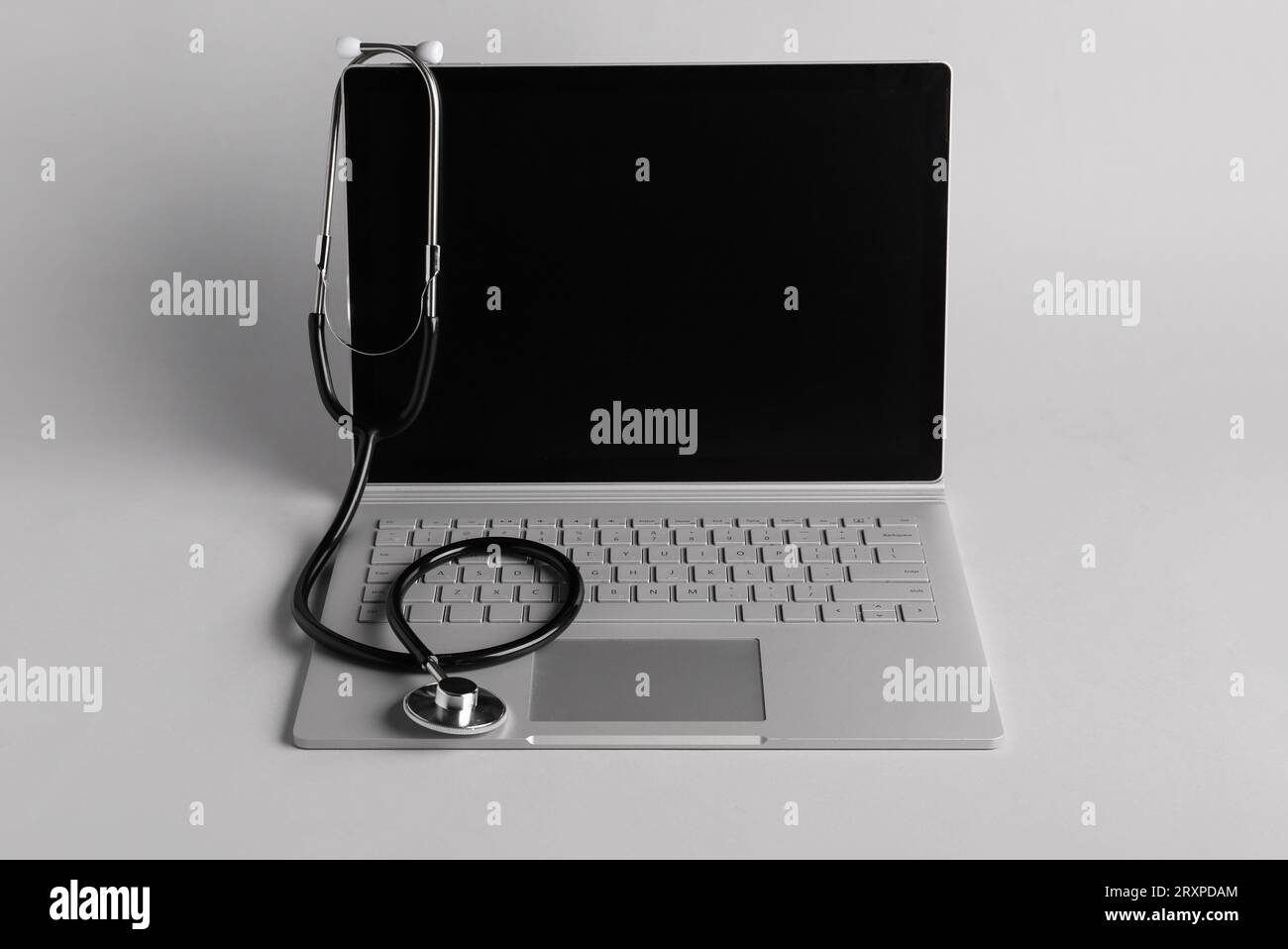 Stethoscope and laptop on light background Stock Photo - Alamy