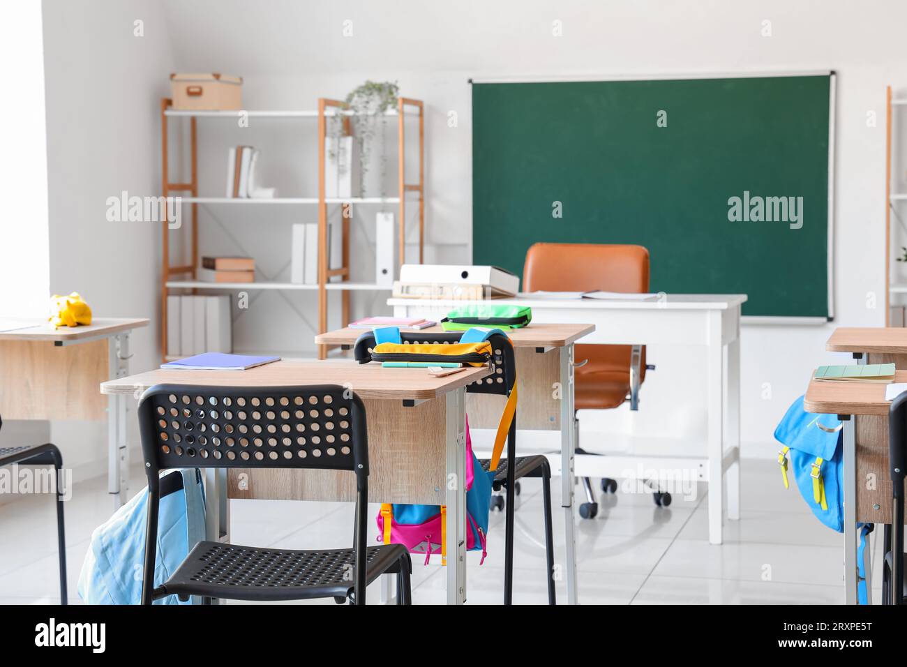 Interior of modern classroom with desks and chairs at school Stock ...