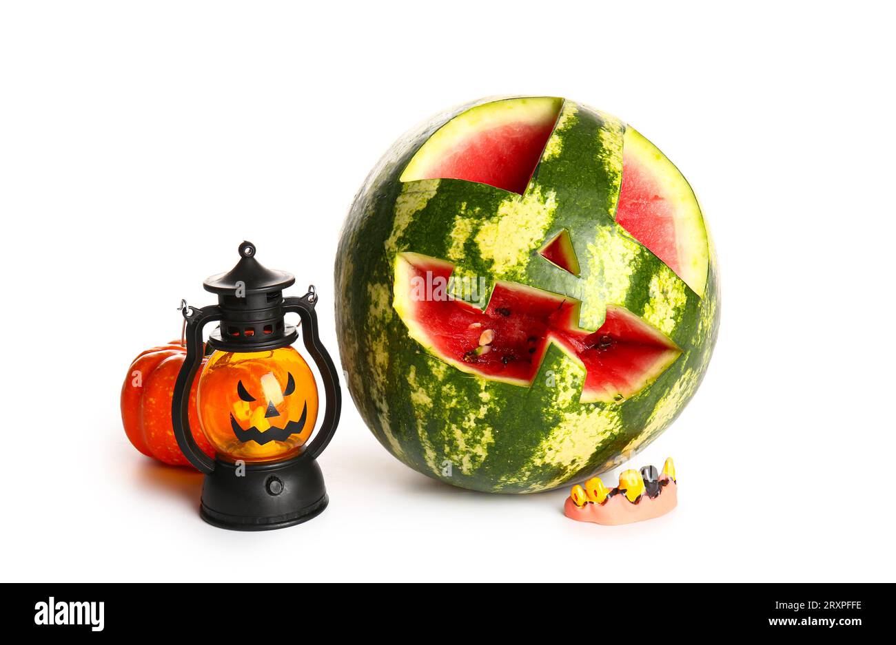 Carved watermelon for Halloween with lantern and jaw on white ...