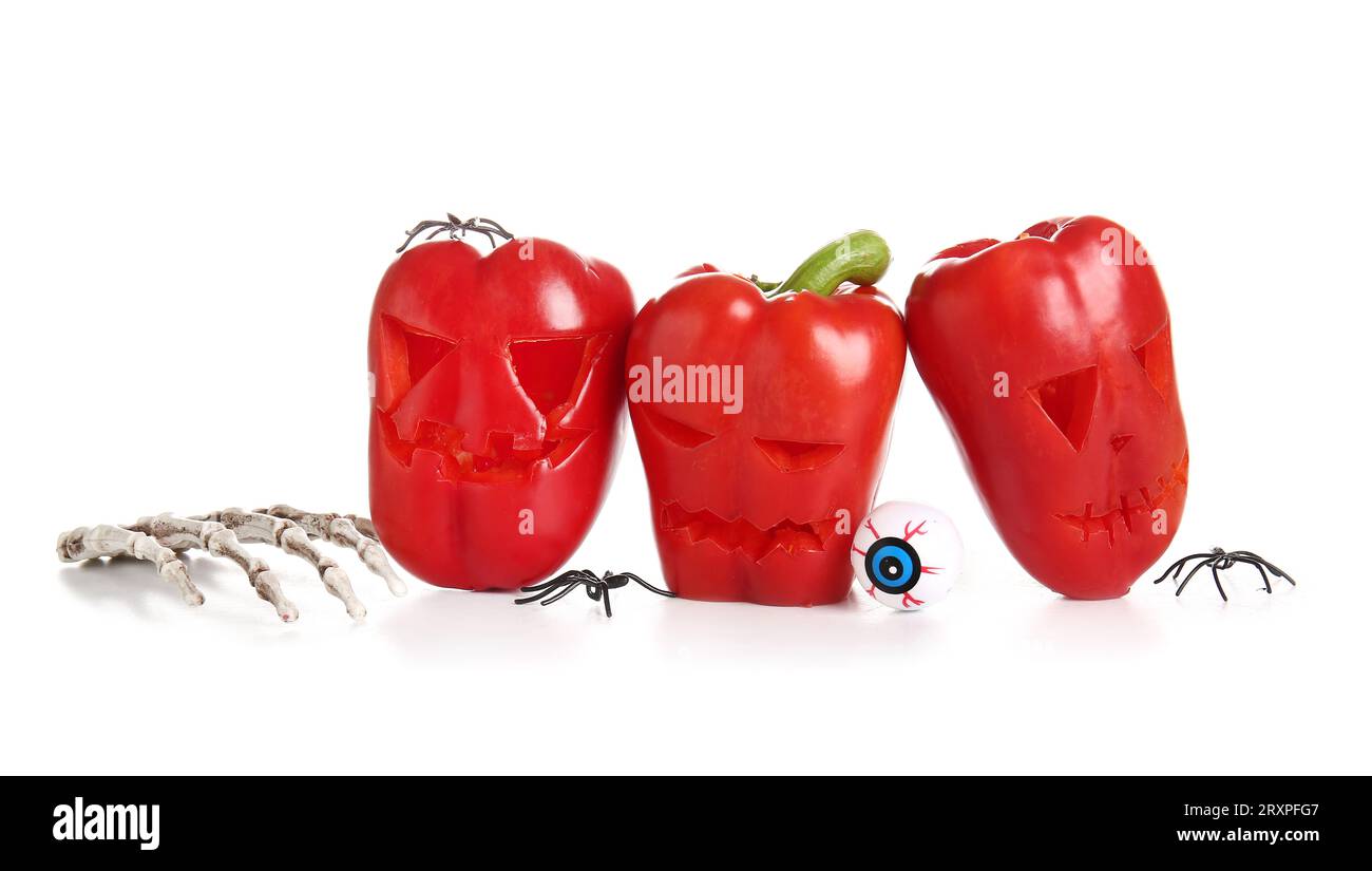Carved bell peppers for Halloween with skeleton hand, eye and spiders ...