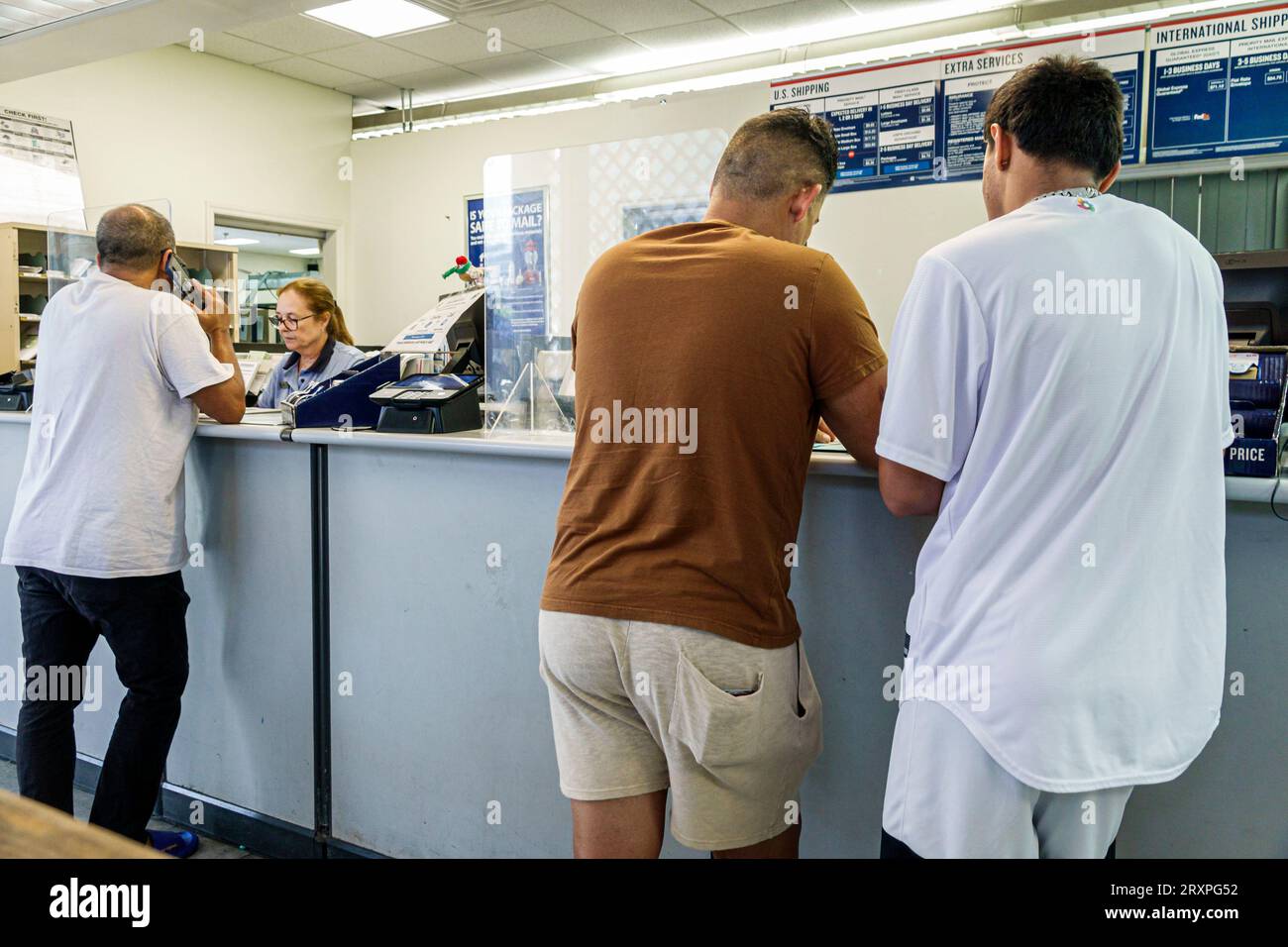 Postal clerk employee worker working work workplace job hi-res stock ...