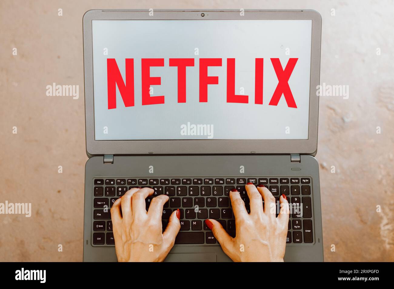 In this photo illustration, the Netflix logo is displayed on a laptop ...
