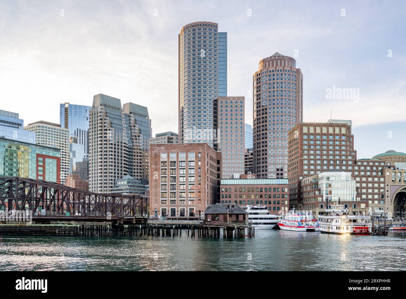 Cityscape of an old abandoned truss bridge in the bay on the modern ...