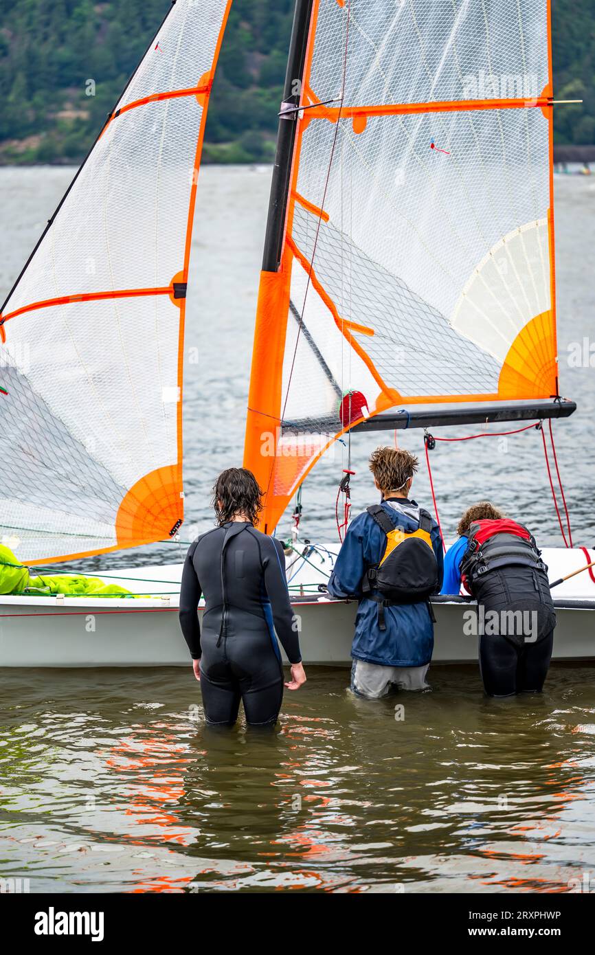 Three friends in a protective suits prefer outdoor activities and ...