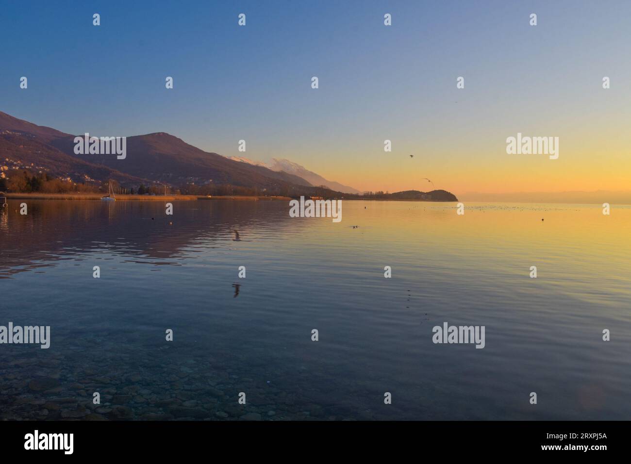 Pier and sunset, Ohrid lake, Ohrid Macedonia Stock Photo - Alamy