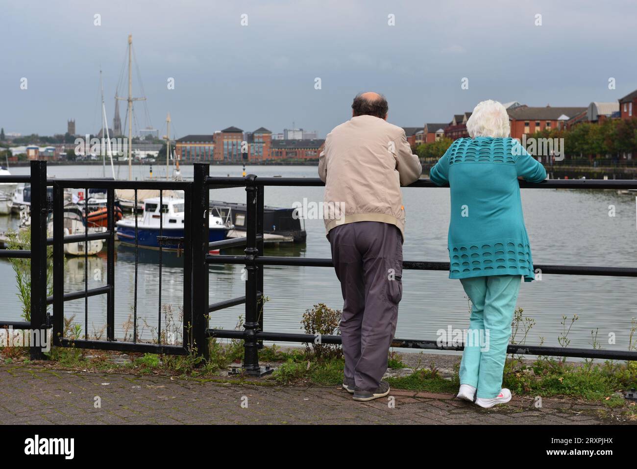 Elderly couple looking out over Preston Marina Stock Photo - Alamy