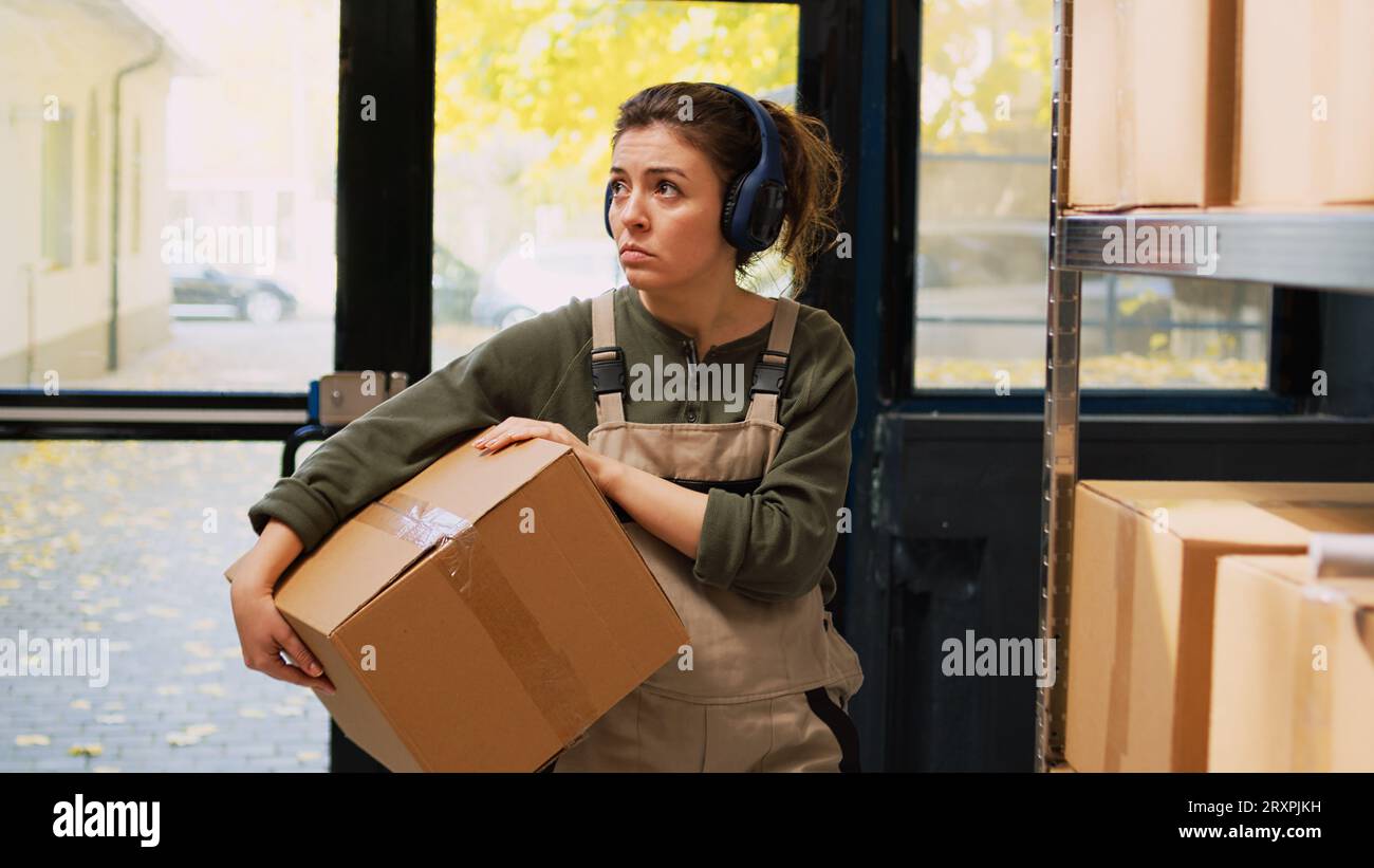 Woman employee moving products packages hi-res stock photography and ...