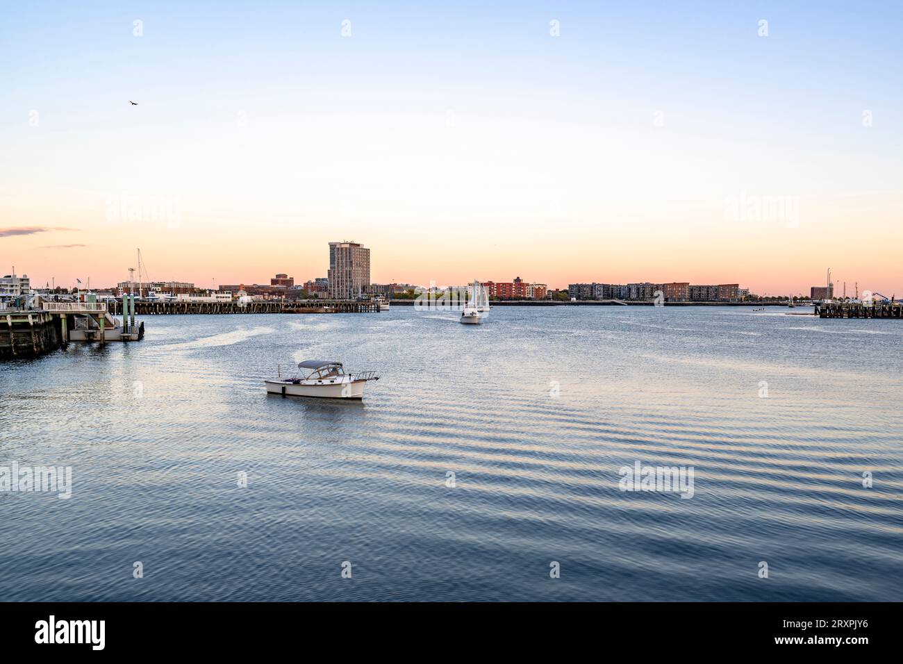 Yachts and boats in Boston Harbor with wooden piers protruding into the ...