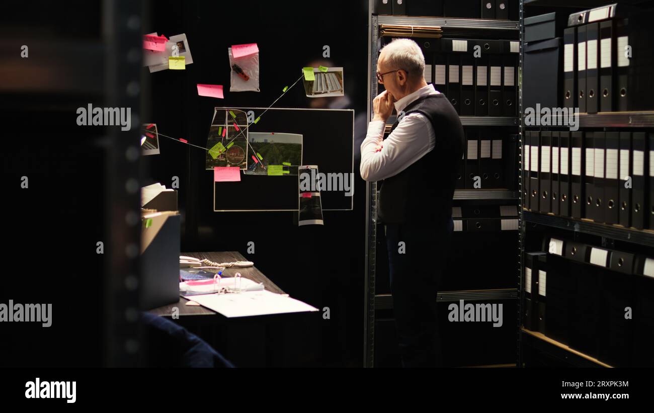Crime expert reviews forensic evidence in police agency incident room ...