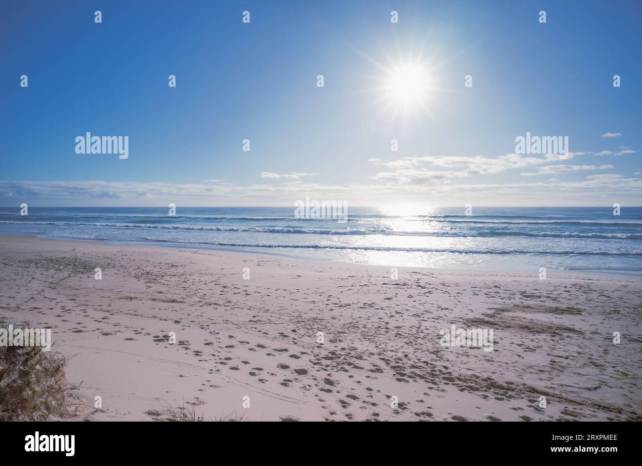 Sun rising waves breaking on sandy shore.Conceptual background for ...