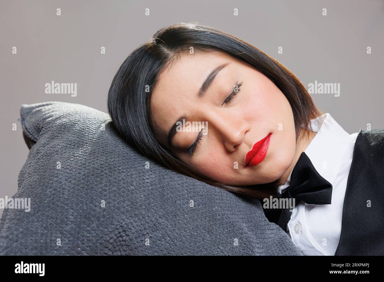 Tired sleepy woman receptionist with closed eyes lying head down on ...