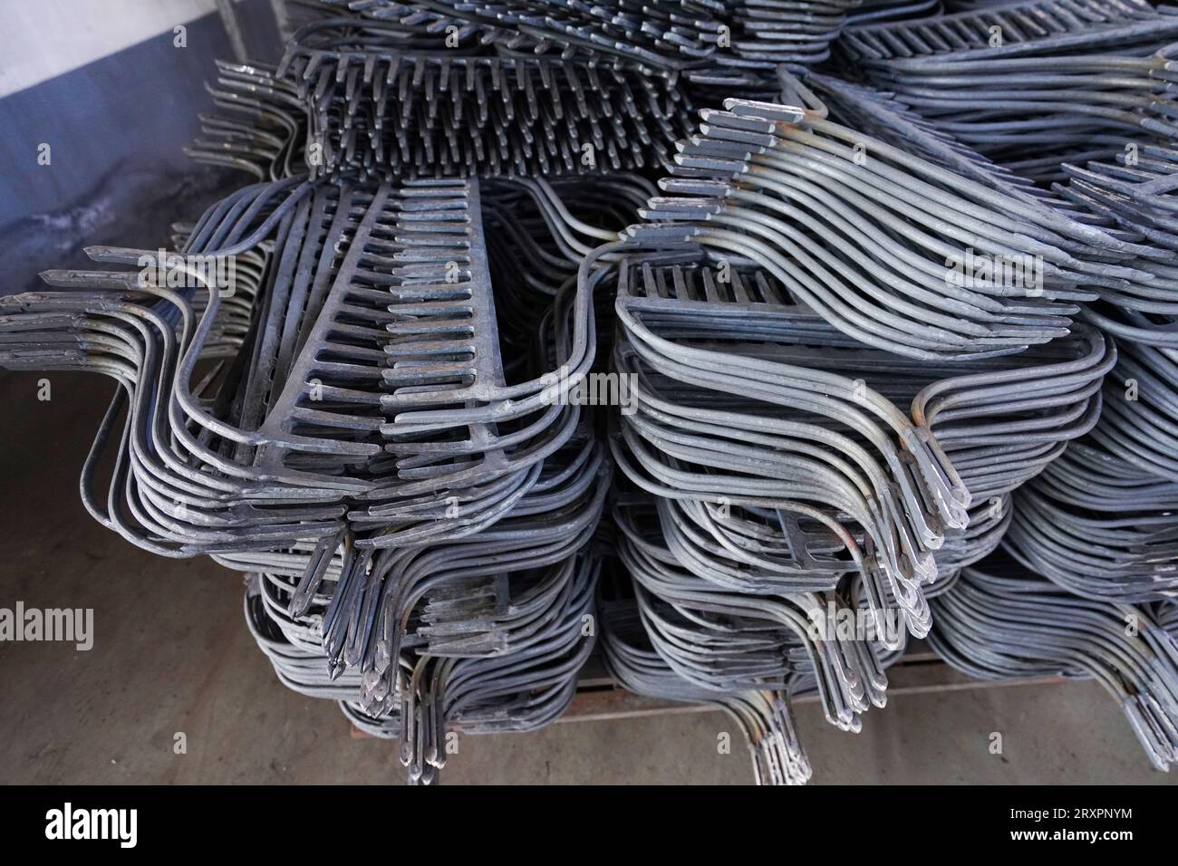 The semi-finished products of the nail rake are stacked together Stock ...