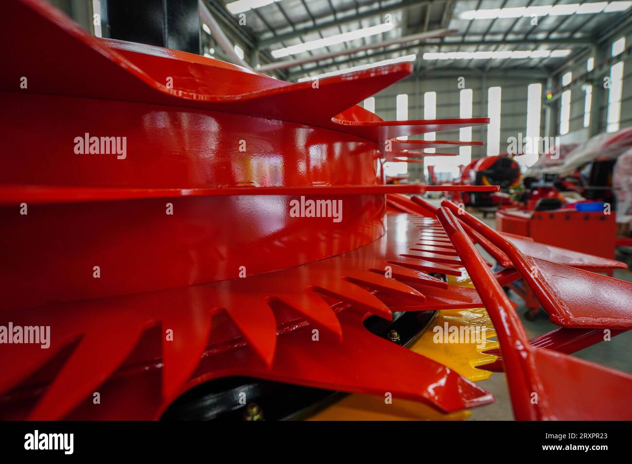 Green feed harvester header stored in the factory area Stock Photo - Alamy