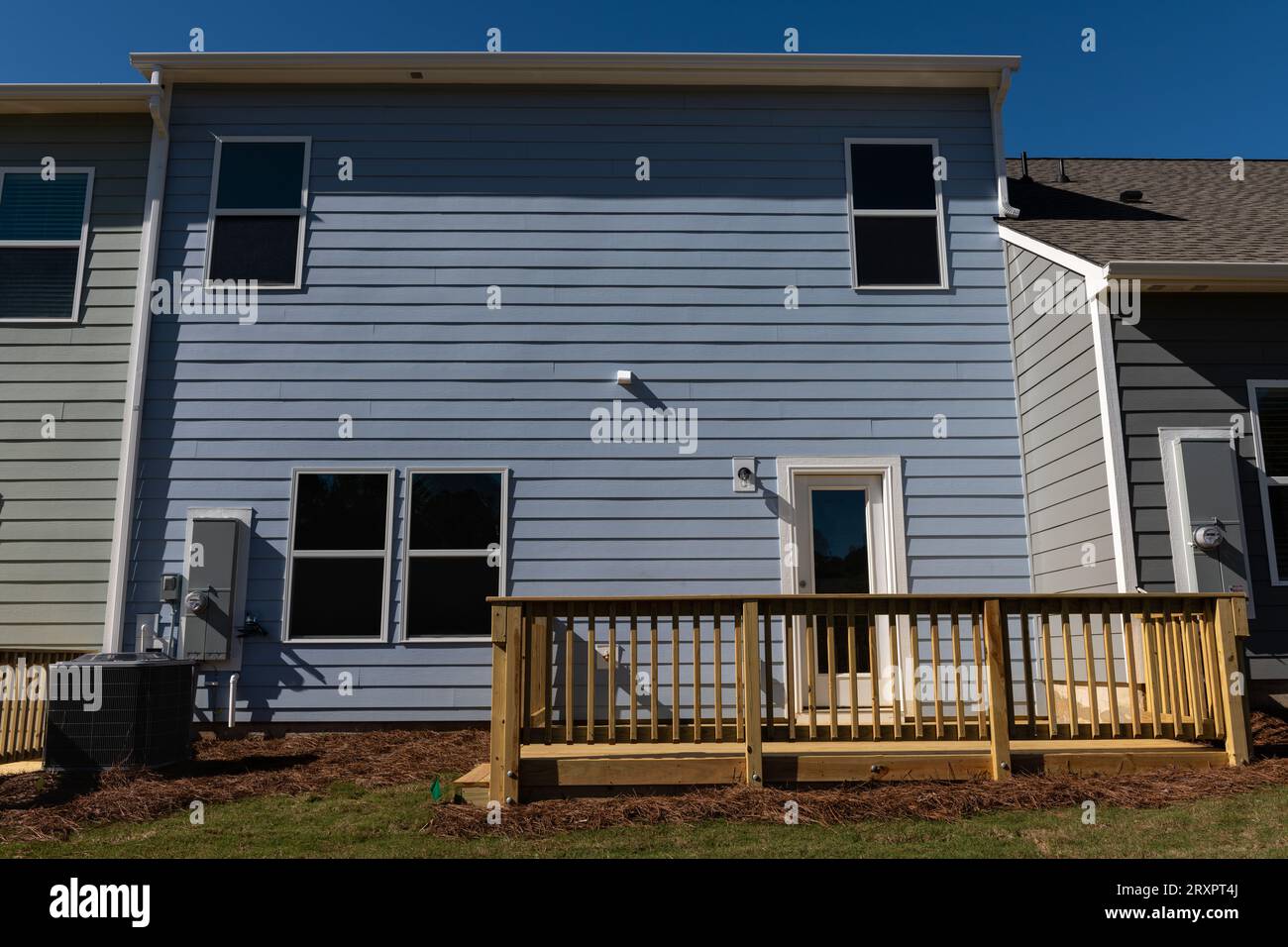 New suburban residential townhomes buildings with back wood decks Stock ...