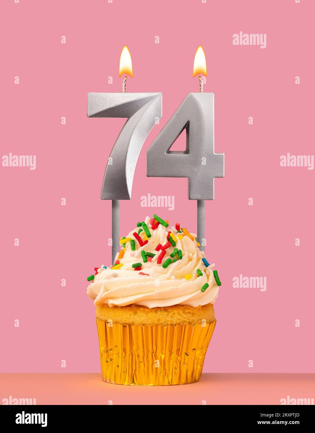 Number 74 candle with cupcake - Birthday card Stock Photo - Alamy