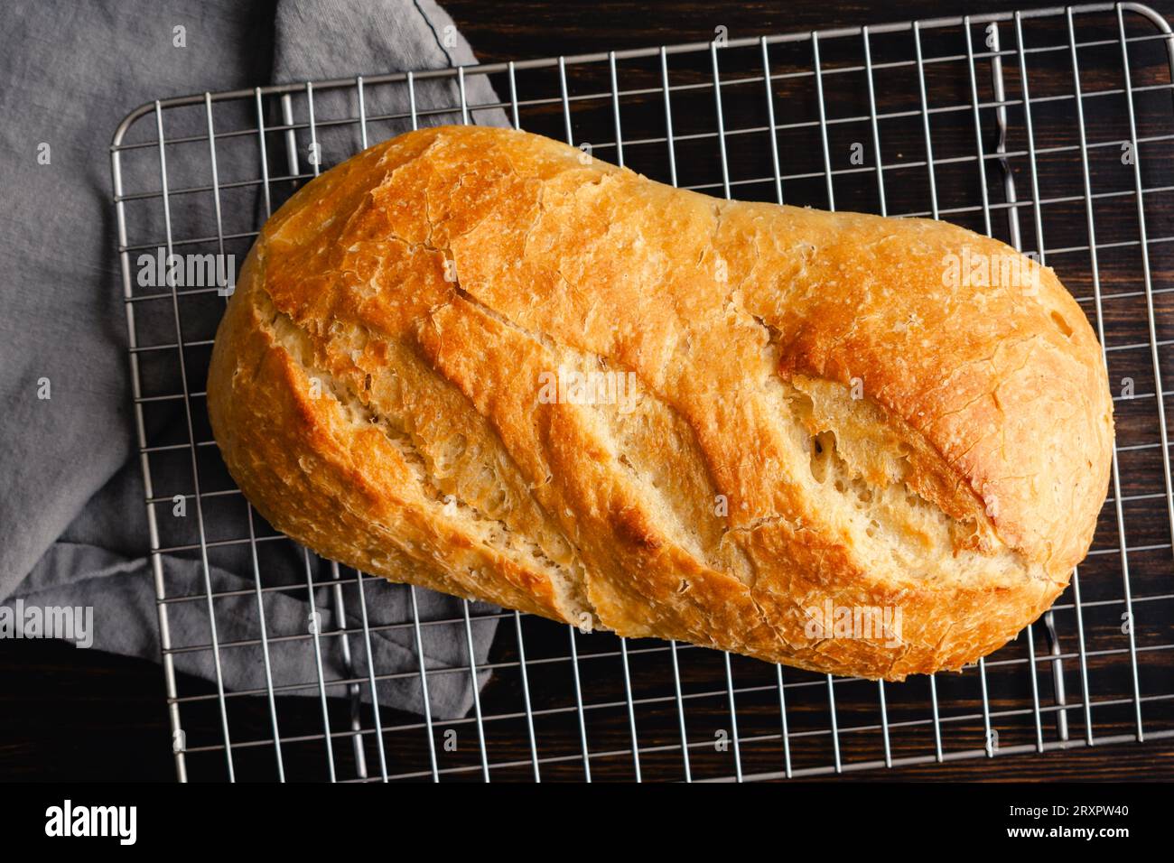 Loaf of Freshly Baked Sourdough Bread: An unsliced loaf of crusty ...