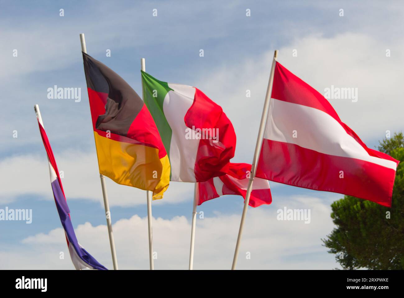 German, Italian, Austrian and Swiss flags flutter in the wind Stock ...