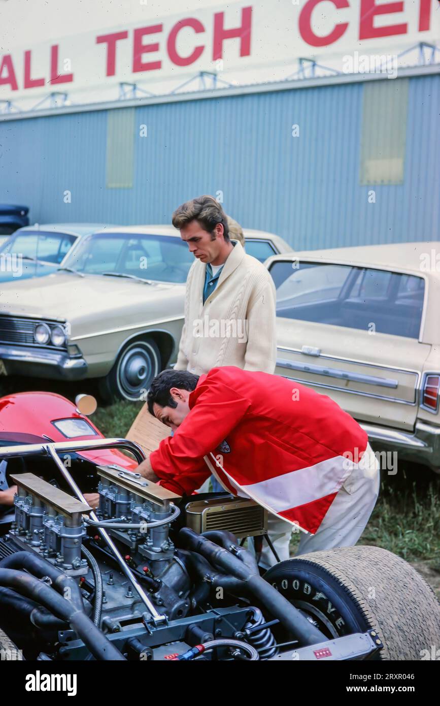 Lothar Motschenbacher looking at his Motschenbacher Racing McLaren M6B ...