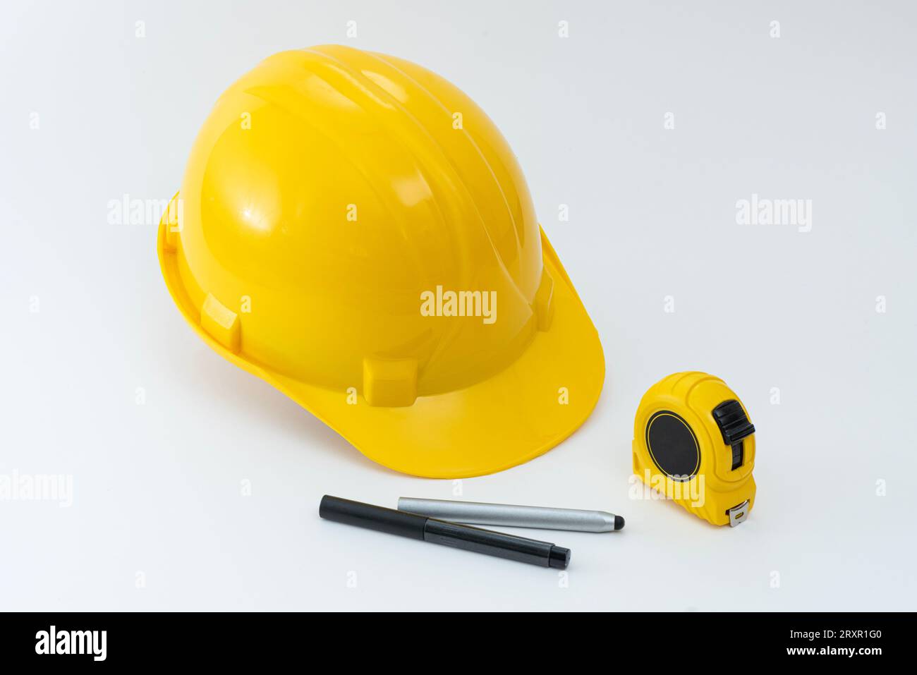 Yellow safety helmet and tools isolated on white background Stock Photo ...