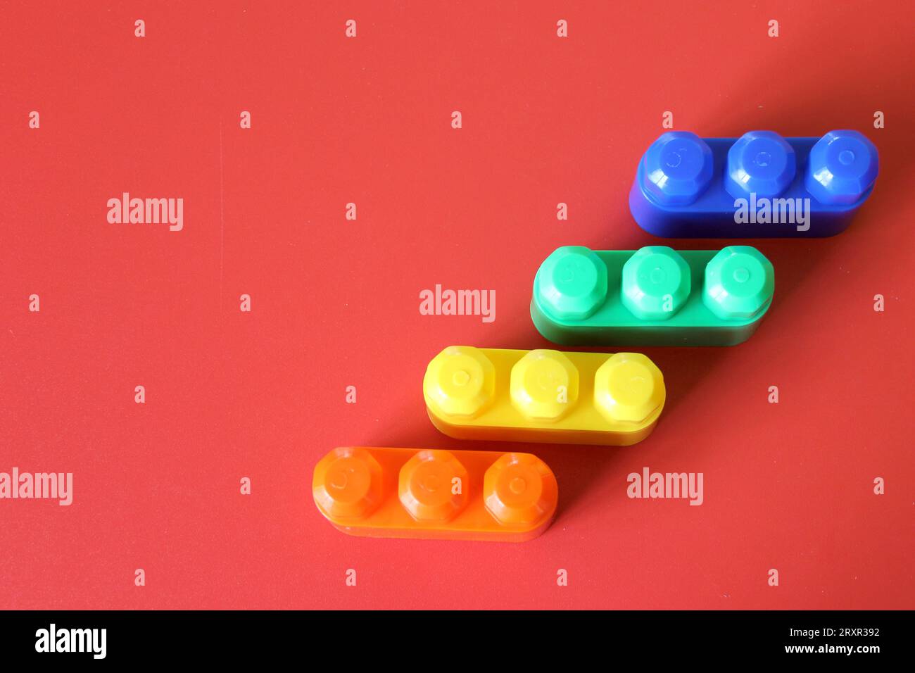 Pieces of plastic rainbow multicolored buildable toy blocks formed and ...