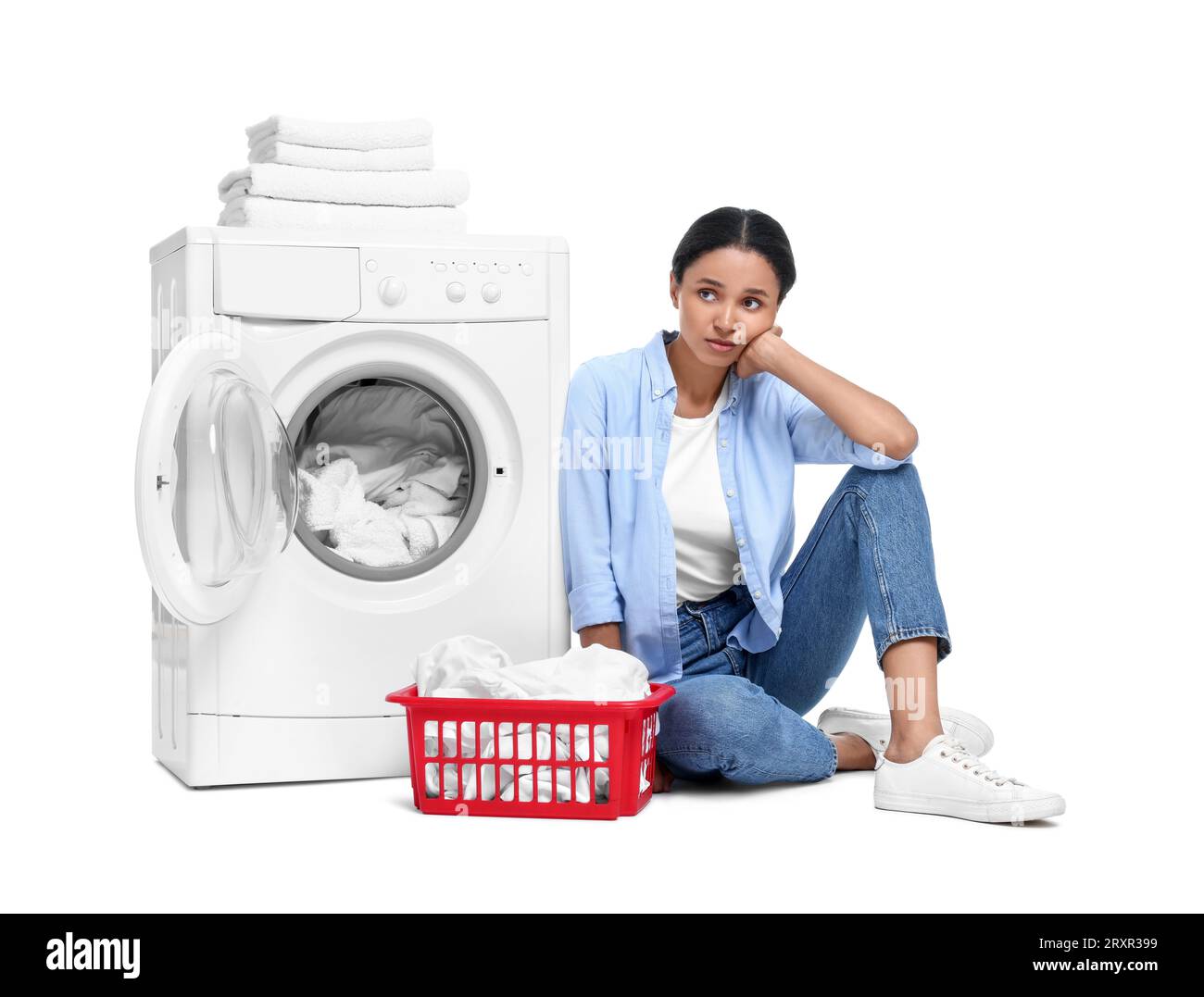 Woman sitting on washing machine hi-res stock photography and images ...