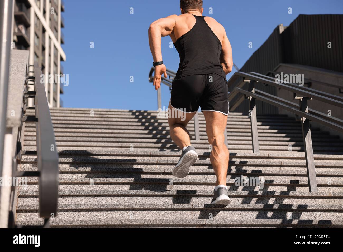 Man running up stairs hi-res stock photography and images - Alamy