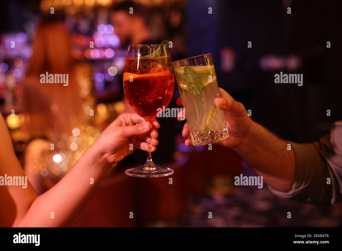 People clinking glasses with fresh cocktails in bar, closeup Stock ...