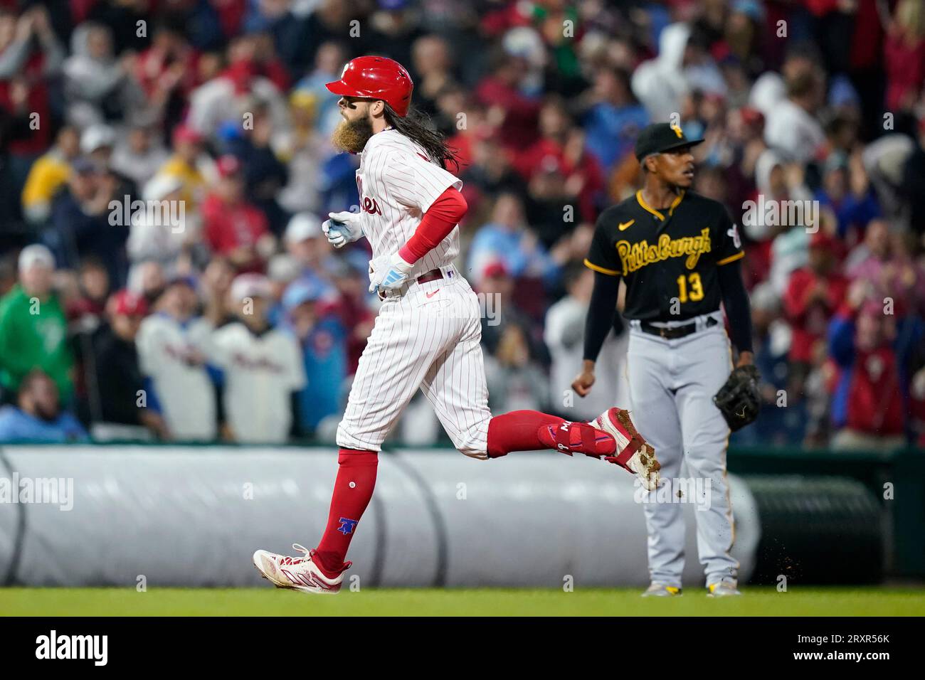 Philadelphia Phillies' Brandon Marsh, left, rounds the bases past ...
