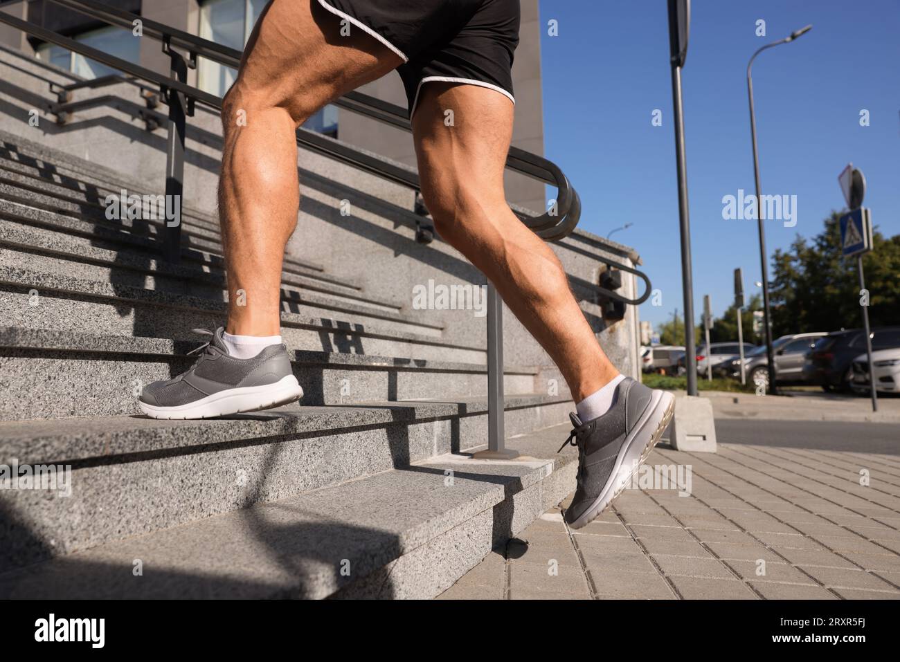 Man running up stairs hi-res stock photography and images - Alamy