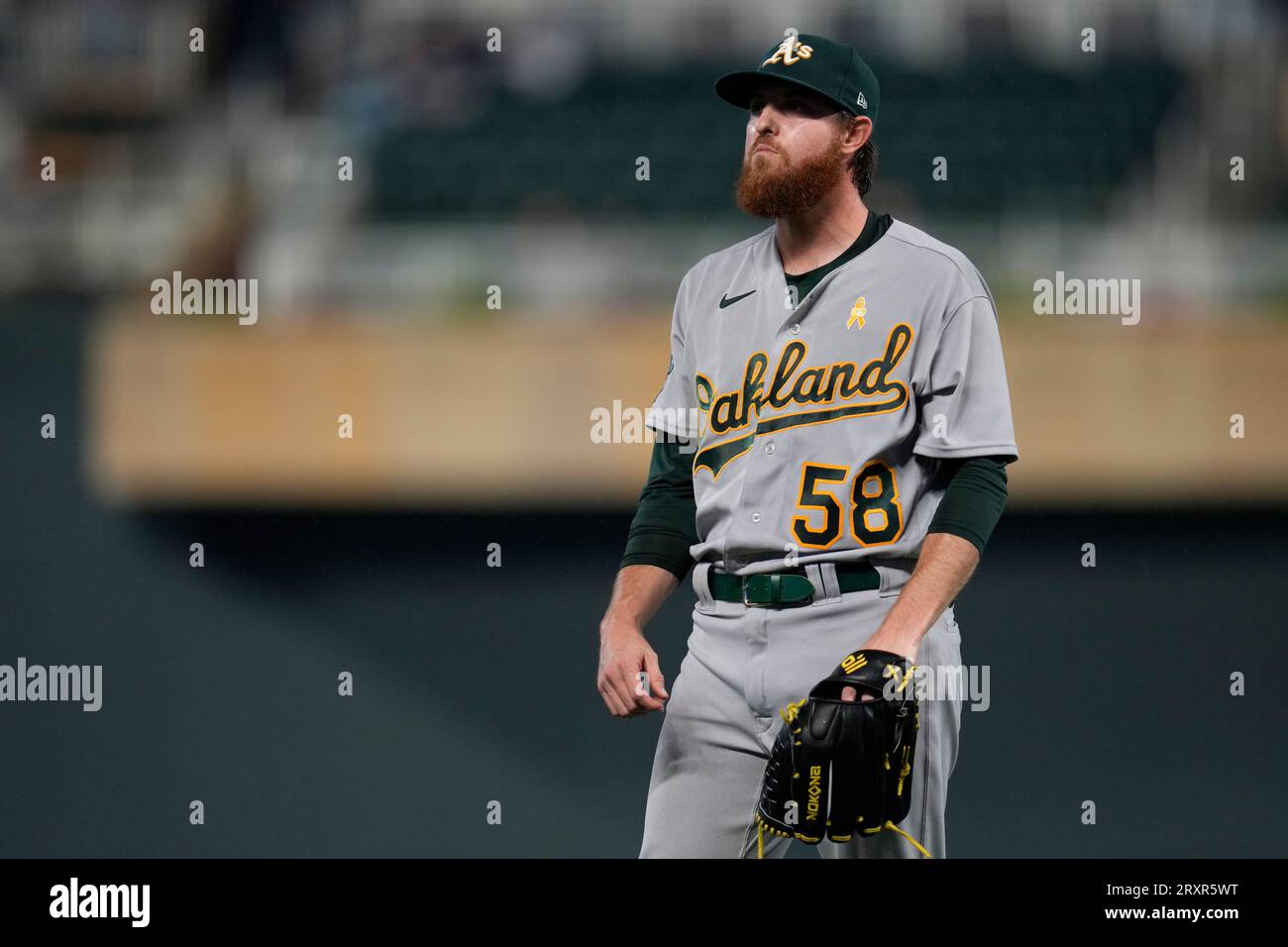 Oakland Athletics starting pitcher Paul Blackburn reacts after loading ...