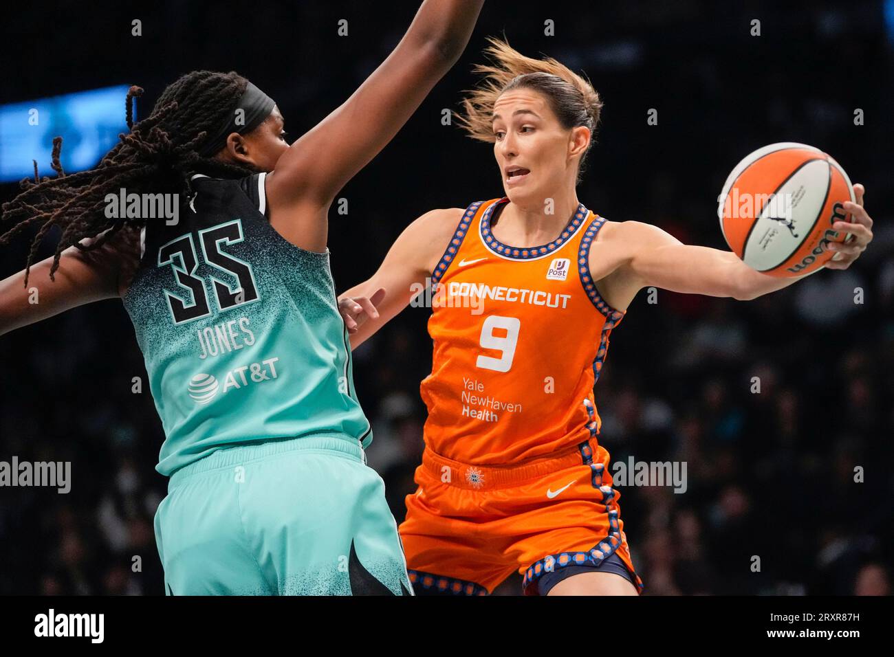 Connecticut Sun guard Rebecca Allen (9) moves the ball around New York ...