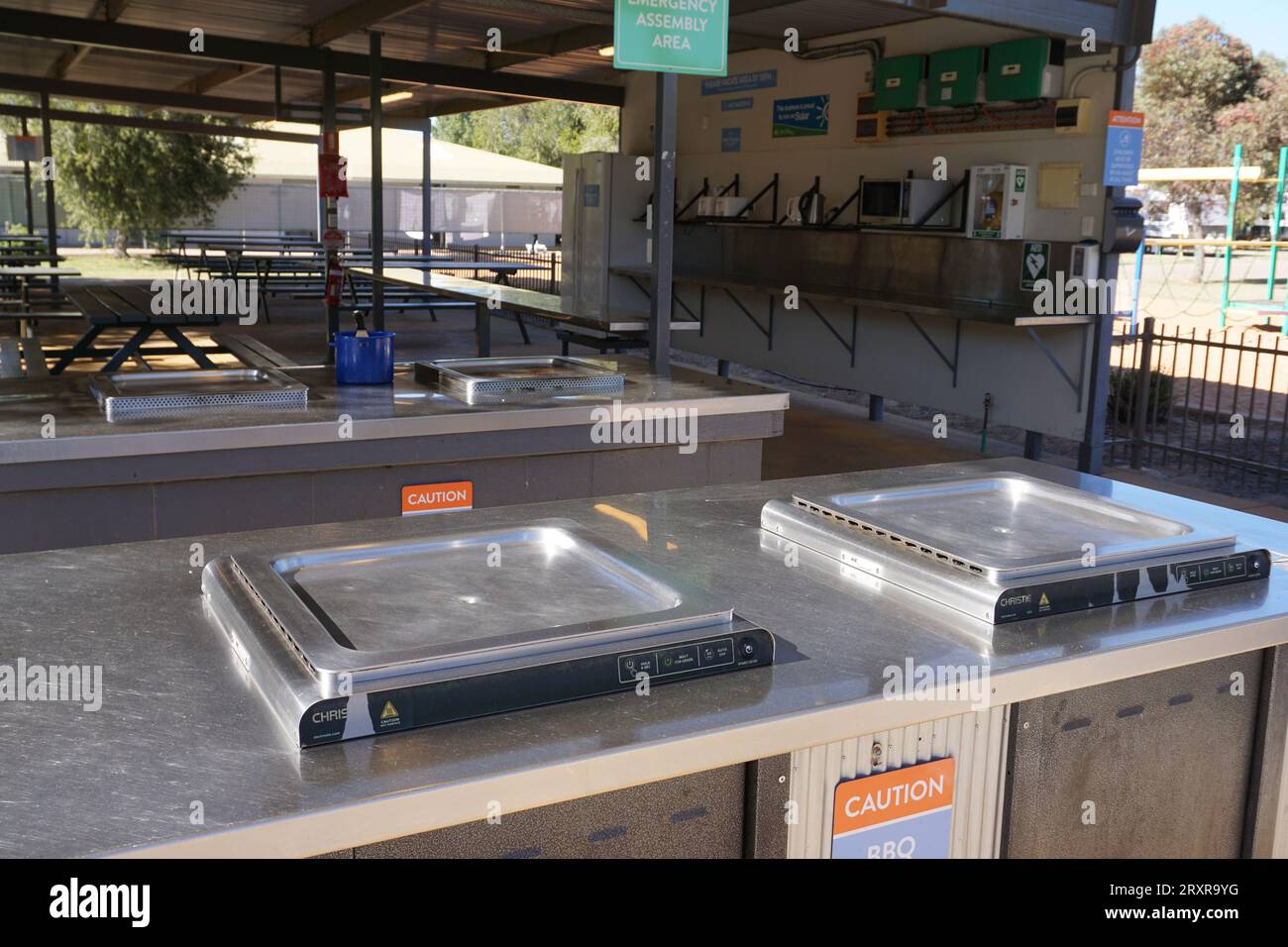 a camp kitchen at a campground or holiday park with electric barbeques ...