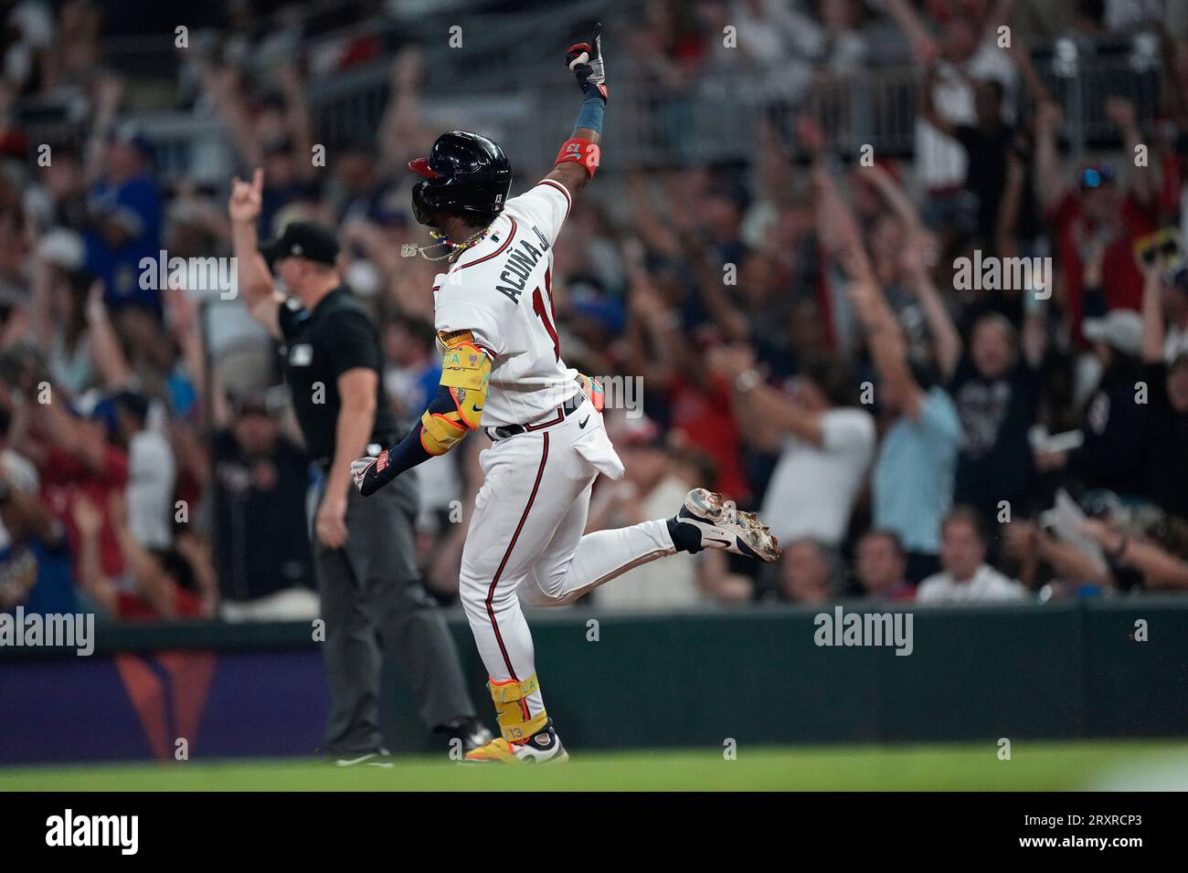 Atlanta Braves' Ronald Acuna Jr. (13) gestures to the crowd as he runs ...